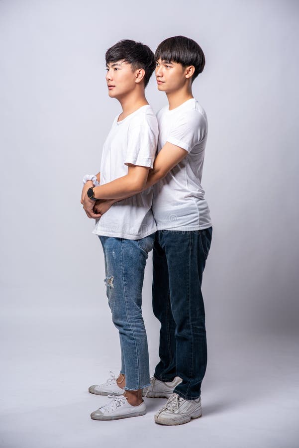 Two Men Who Love Each Other Hug from Behind Another Stock Image - Image ...