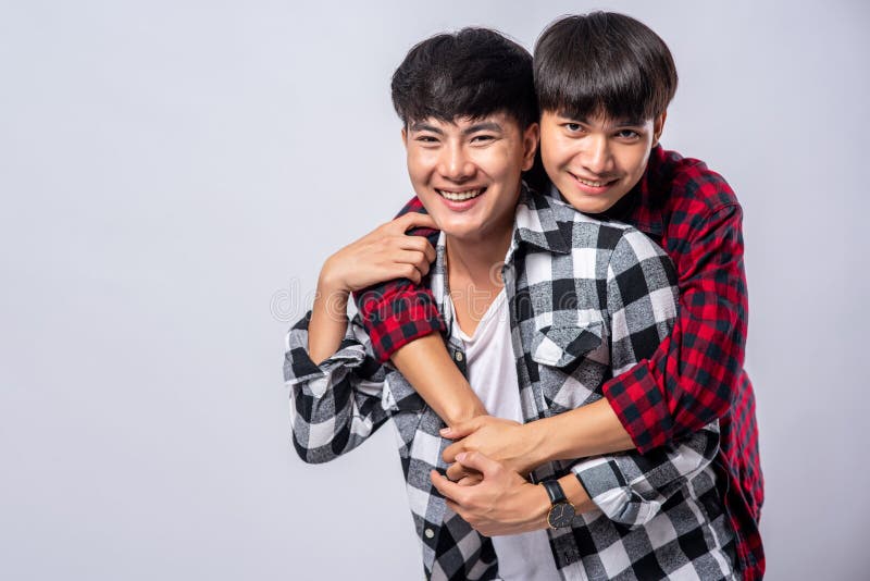 Two Men Who Love Each Other Hug from Behind Another Stock Photo - Image ...