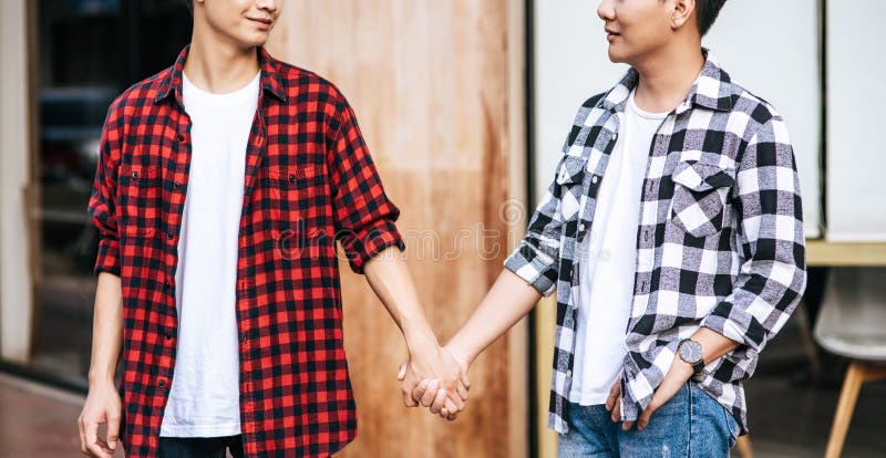 Two Men Who Love Each Other Stand Hand in Hand Stock Photo - Image of ...
