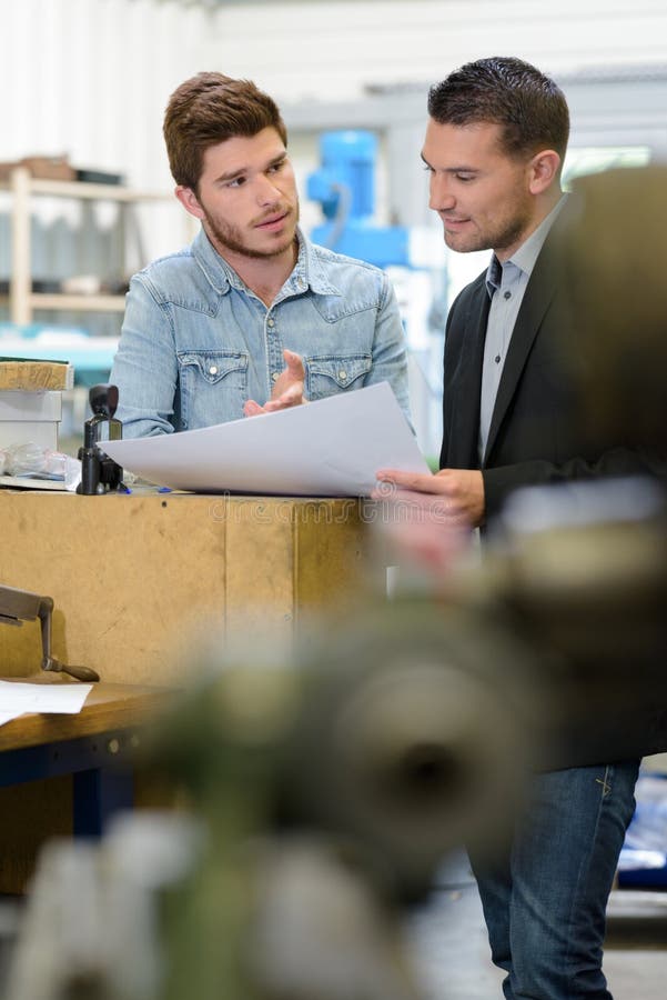 Two men at work stock image. Image of modern, assistant - 237933063