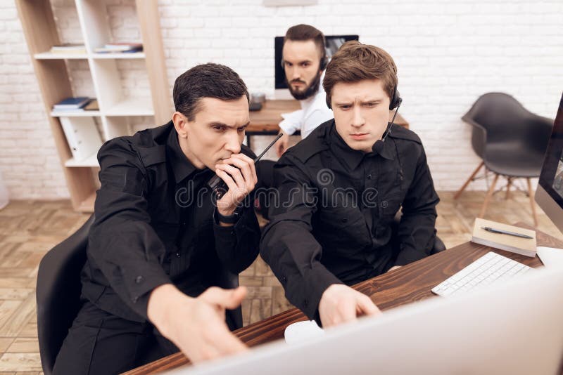 Two men work as guards. stock image. Image of occupation - 113769725