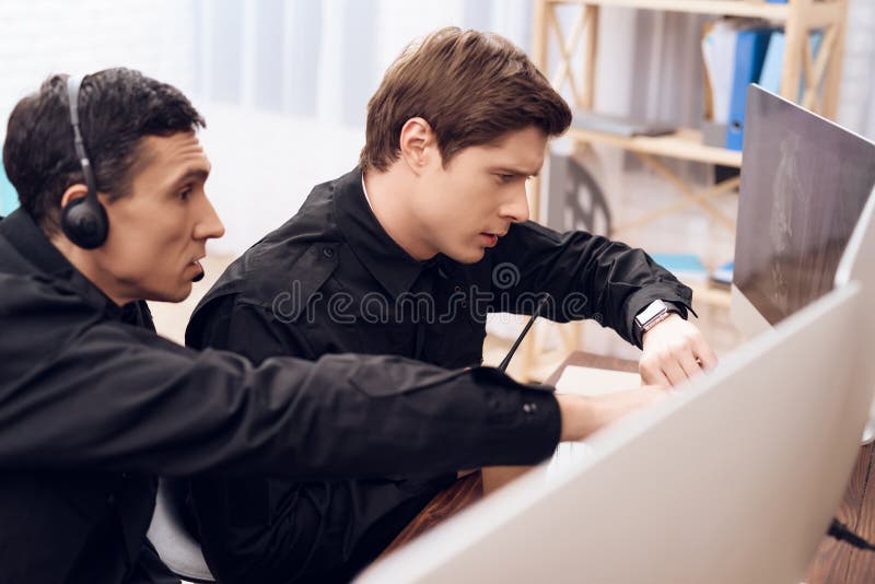 Two men work as guards. stock photo. Image of prevention - 113769804