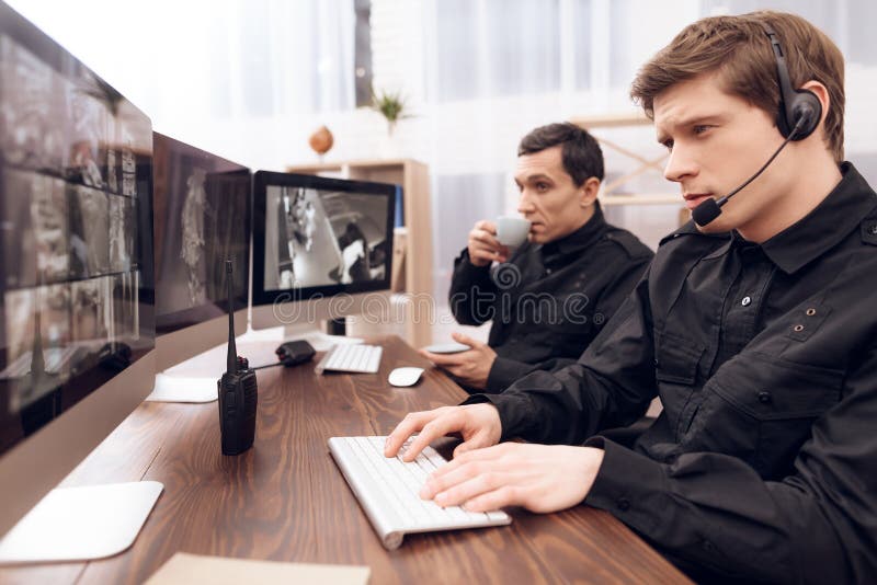 Two men work as guards. stock image. Image of closed - 113769621