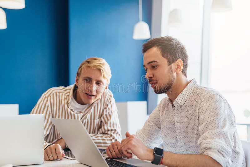 Two Men Work in Office Using Laptop Stock Photo - Image of teamwork ...