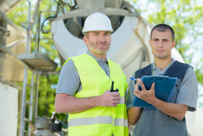 Two men on work site stock image. Image of worker, reflective - 280479593
