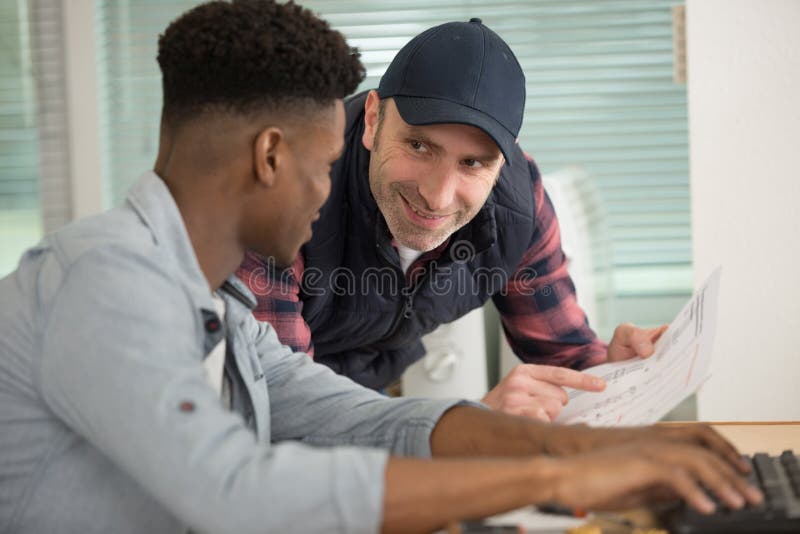 Two men work in studio stock image. Image of inside - 197679431
