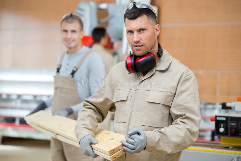 Two Men in Work-wear with Wood in Carpenters Workshop Stock Image ...