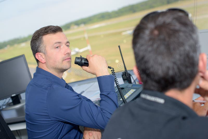 Two Men Working in Airport Control Tower Stock Image - Image of tower ...