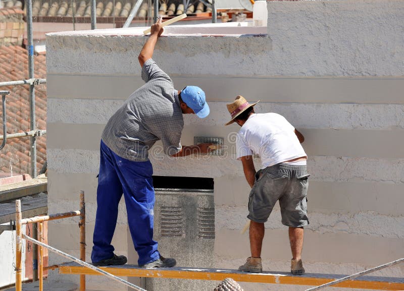 Two Men Working on Building a House, Facade of White Cement Editorial ...