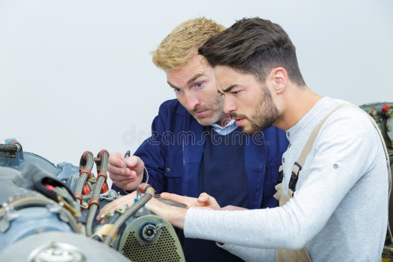 Two Men Working with Engine Stock Image - Image of togetherness ...