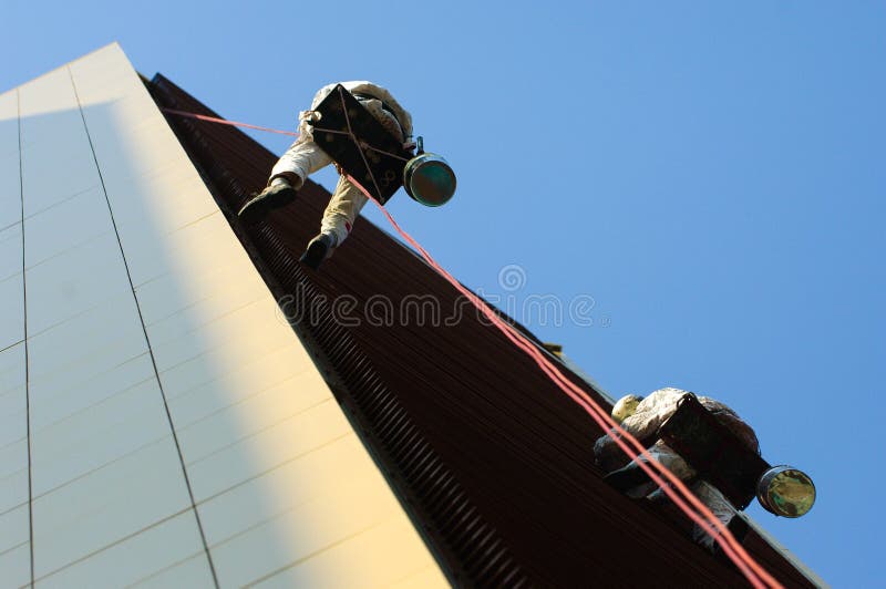 Two men working on height stock photo. Image of concrete - 36823536