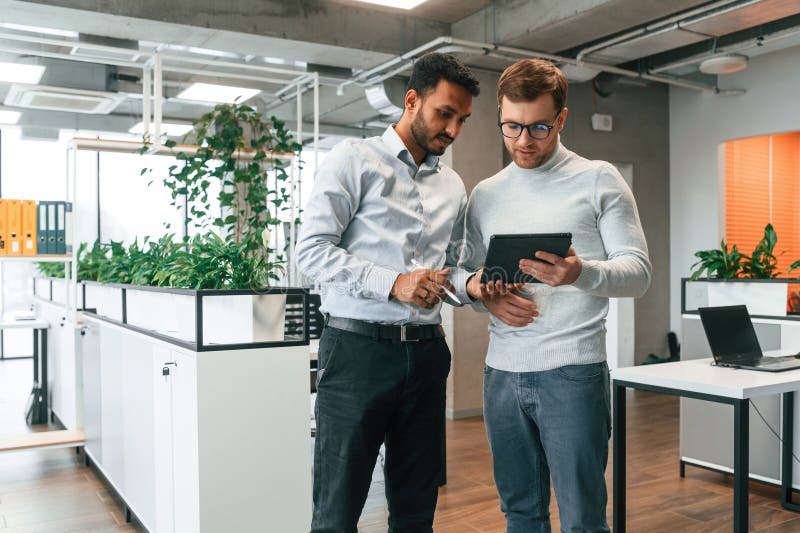 Two Men are Working in the Modern Office Together Stock Photo - Image ...