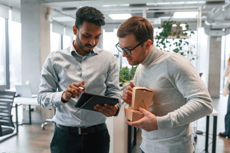 Two Men are Working in the Modern Office Together Stock Photo - Image ...