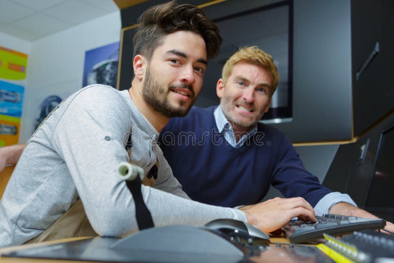 Two Men Working Together for Computers Stock Photo - Image of people ...