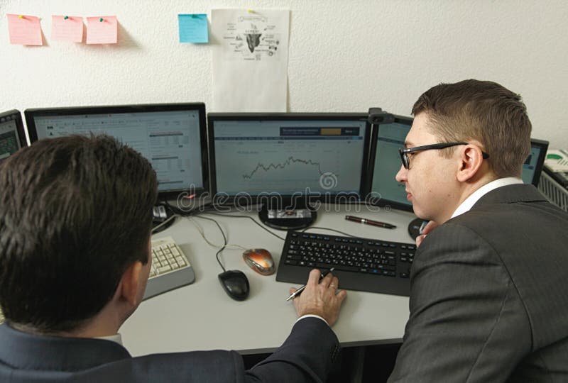Two Men Working Together for the Computers in the Office Engaged in ...