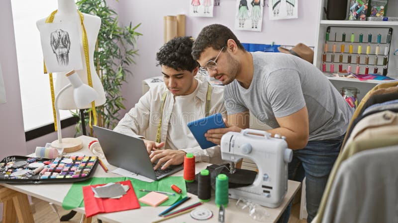 Two Men Working Together in a Tailor Shop, Surrounded by Fabric, a ...