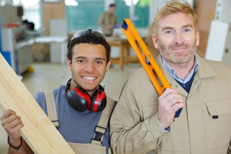 Two Men Working Together To Build Wooden Frame Stock Image - Image of ...