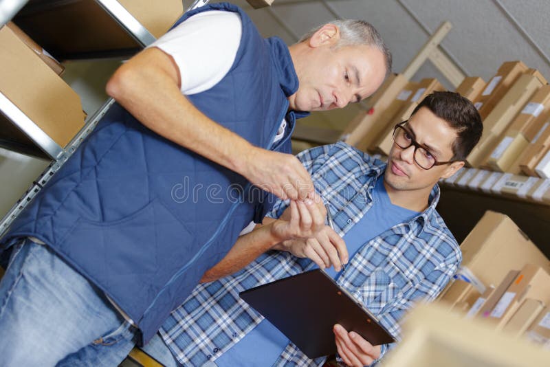Two Men Working on Warehouse Stock Photo - Image of depot, business ...