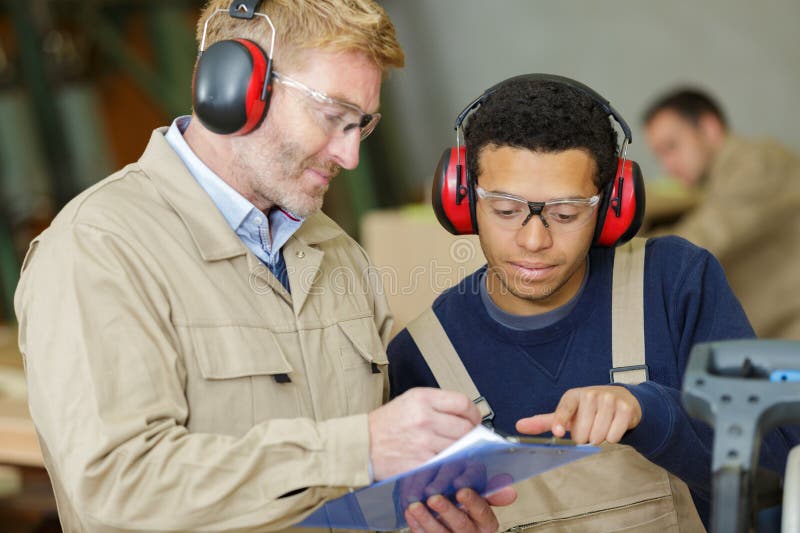 Two Men Working in Workshop Stock Image - Image of industry, repair ...