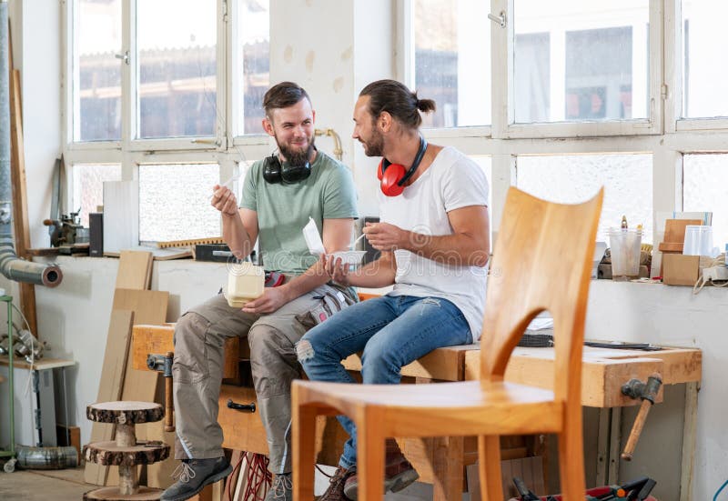 Two Worker in a Carpenter`s Workshop Taking a Break Stock Photo - Image ...