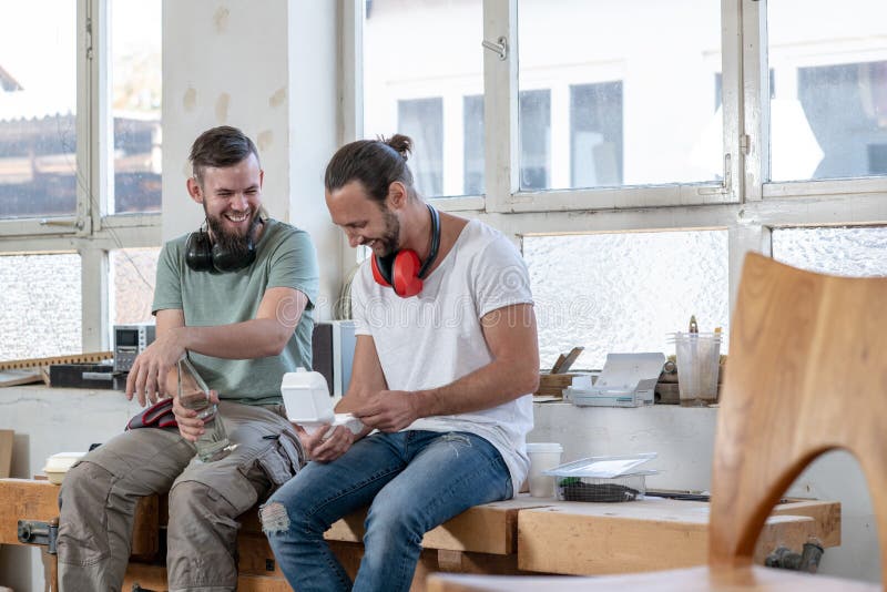 Two Worker in a Carpenter`s Workshop Taking a Break Stock Image - Image ...