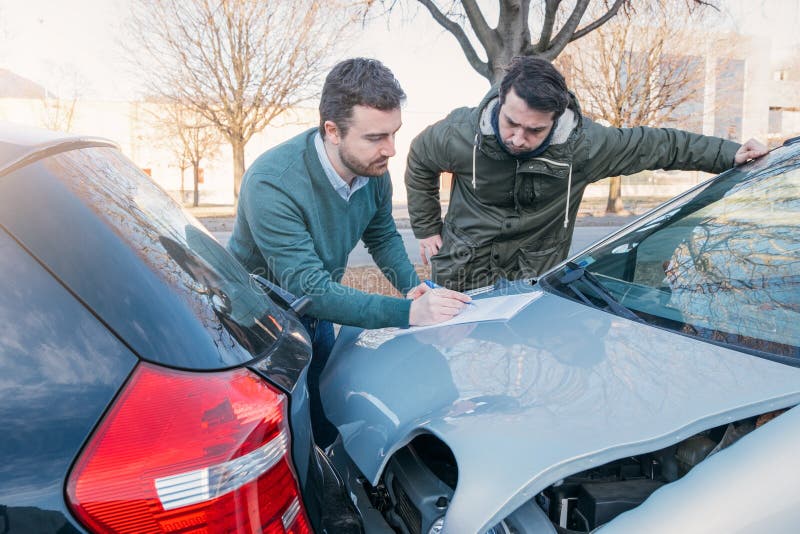 Two Men Writing a Car Insurance Claim Stock Image - Image of sign ...