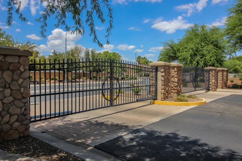 Two Metal Security Gates at Housing Subdivision Stock Image - Image of ...