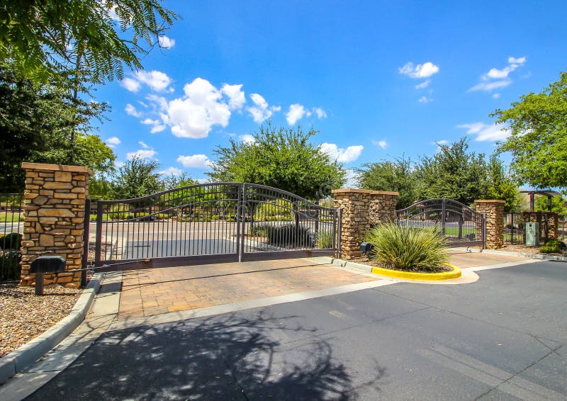 Security Gates at Housing Subdivision Stock Photo - Image of exit, tree ...
