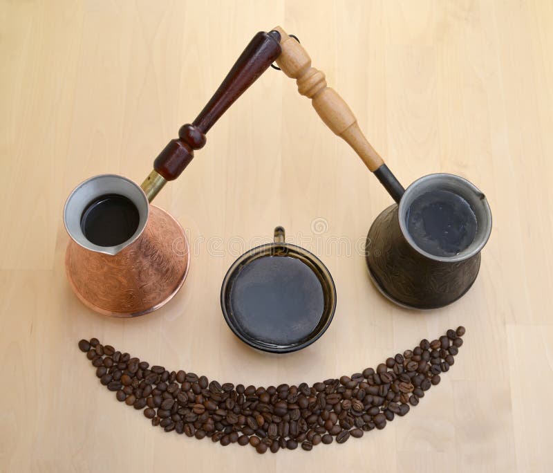 Two Metal Turks, a Cup about Coffee and Coffee Grains on a Light Stock ...