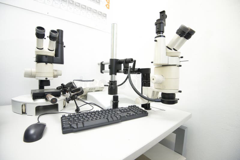 Two microscopes on a desk stock image. Image of instrument - 46915119