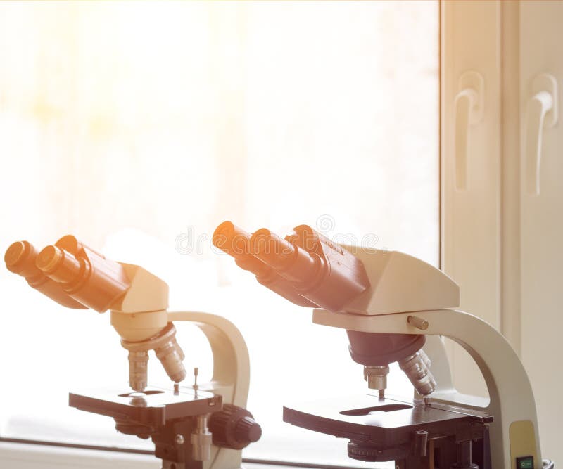 Two Microscopes for Examination Stand in the Laboratory on the Table ...
