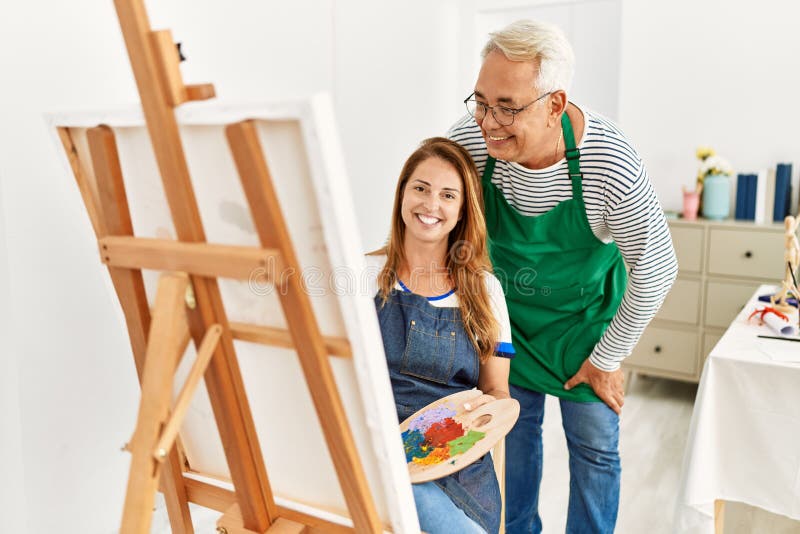 Two Middle Age Artists Smiling Happy Painting at Art Studio Stock Photo ...
