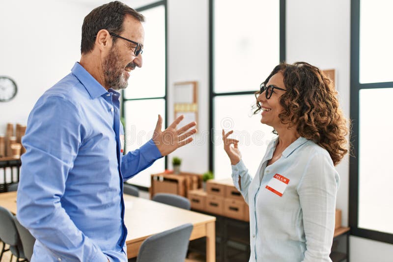 Two Middle Age Business Workers Smiling Happy and Talking at the Office ...