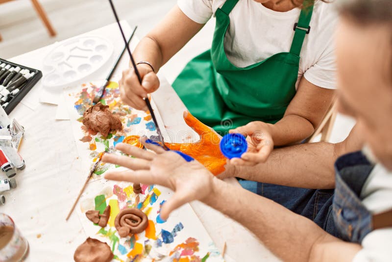 Two Middle Age Student Smiling Happy Painting Hands at Art Studio Stock ...