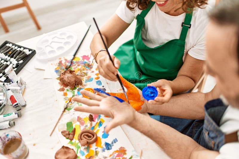 Two Middle Age Student Smiling Happy Painting Hands at Art Studio Stock ...