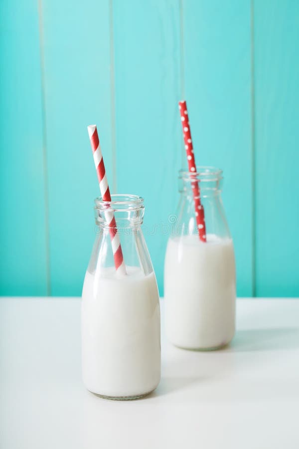 Two Milk Bottles with Red Colored Straw Stock Image - Image of beverage ...