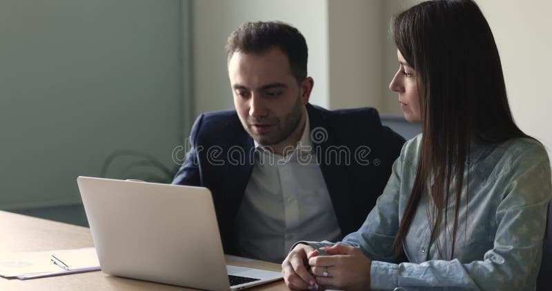 Two Millennial Colleagues Working Together on on-line Project Stock ...
