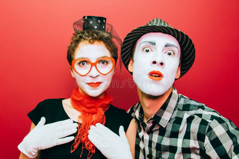 Two Mimes Posing Against a Red Wall Background Stock Photo - Image of ...