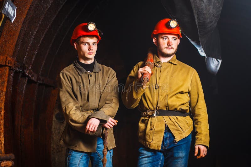 Two Miners in the Mine. Hard Work in a Coal Mine. Tired Workers in a ...