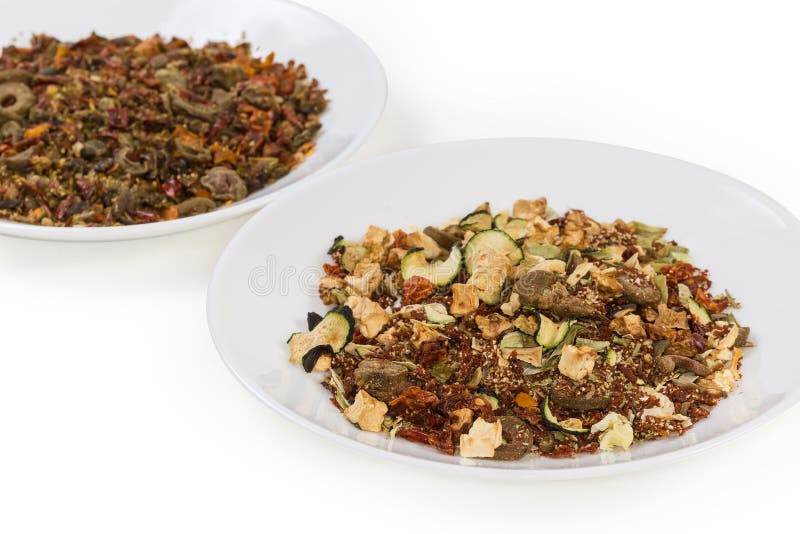 Two Mixtures of Spices and Dried Vegetables on Two Dishes Stock Photo ...