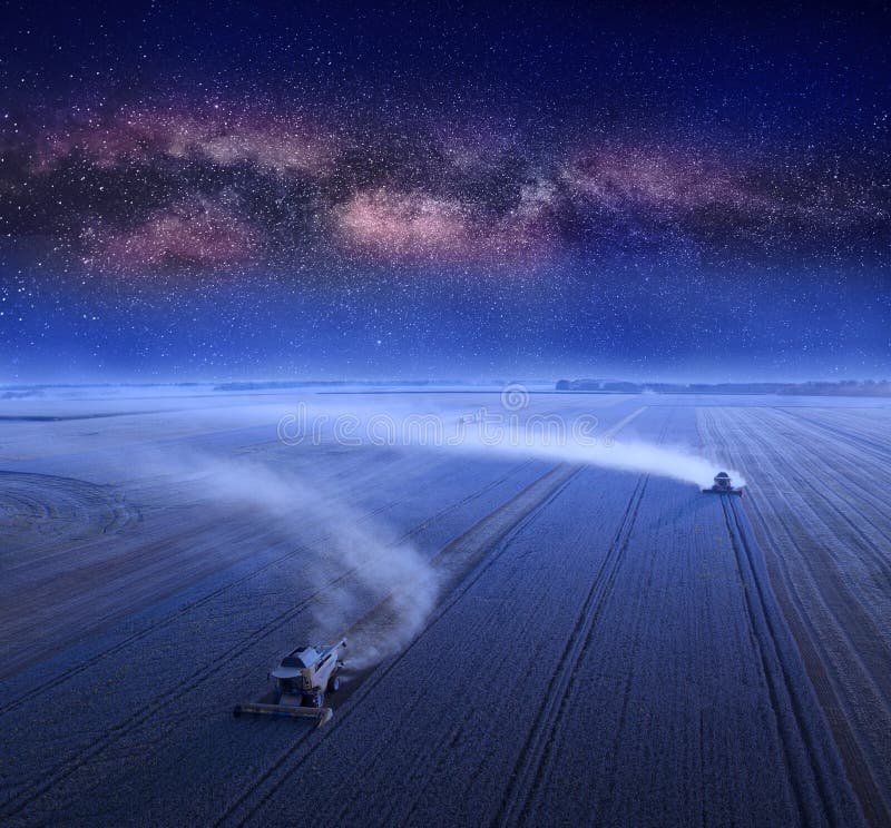 Two Modern New Harvesters Harvest Grain at Night. Stock Image - Image ...