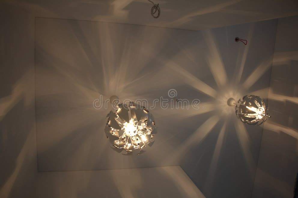 Modern Spherical Pendant Lights Casting Light Patterns on the Ceiling ...