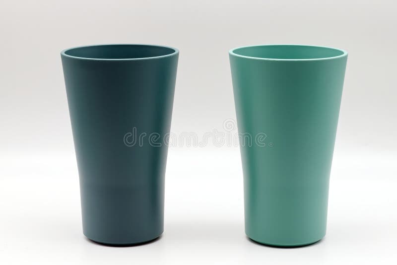 Two Modern Teal and Mint Green Plastic Cups Isolated on White ...