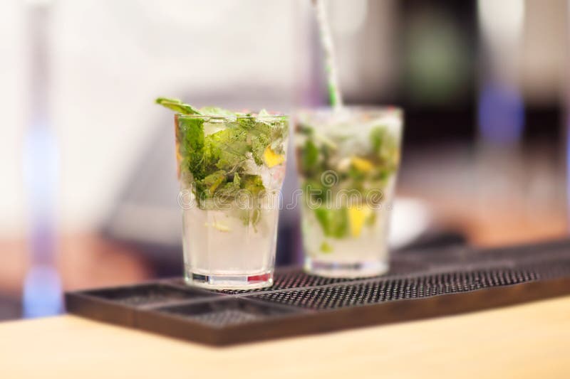 Two Mojito Cocktails on a Bar Counter Stock Photo - Image of mint ...