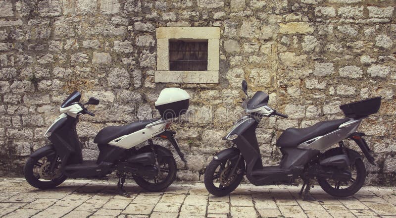 Two Mopeds in Front of the Wall Stock Photo - Image of stone, moped ...
