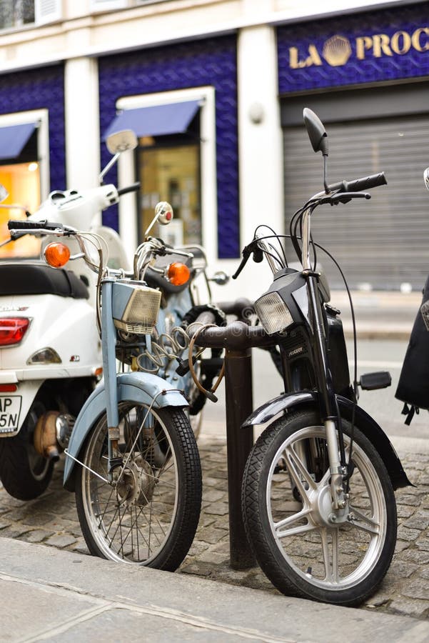 Two Mopeds Looking at Each Other Lovingly in Paris, France Stock Photo ...
