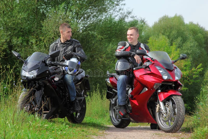 Two Motorcyclists Standing on Country Road Stock Image - Image of ...