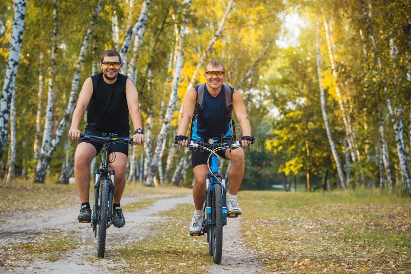 Two Mountain Bikers Riding Bike in the Forest Stock Image - Image of ...