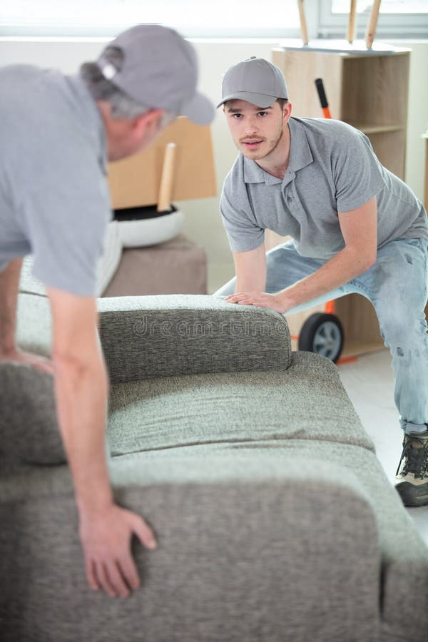 Two Movers Men Carrying Sofa Stock Photo - Image of property, home ...