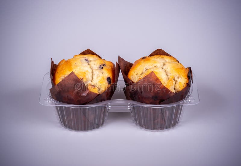 Two Muffins in Plastic Packaging Stock Photo - Image of muffin, light ...